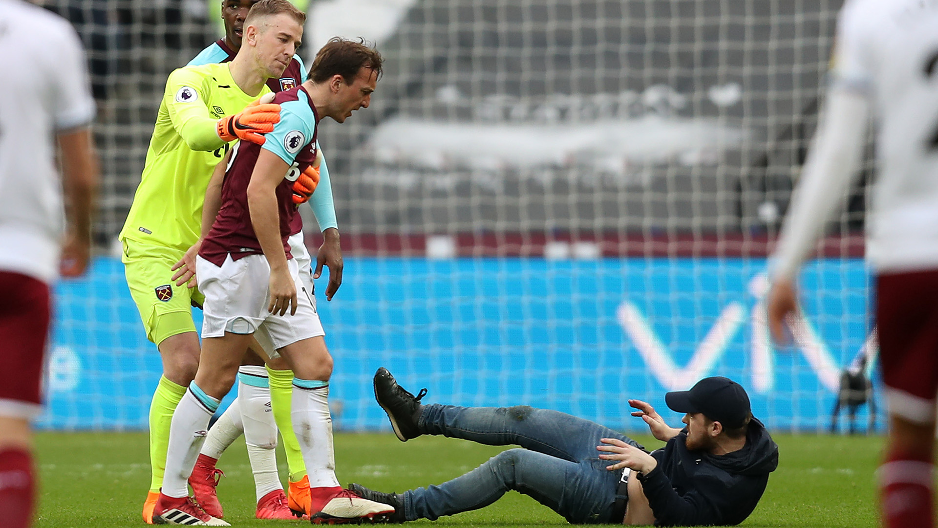 West Ham pitch invasion: Furious fans fight with players over Burnley ...