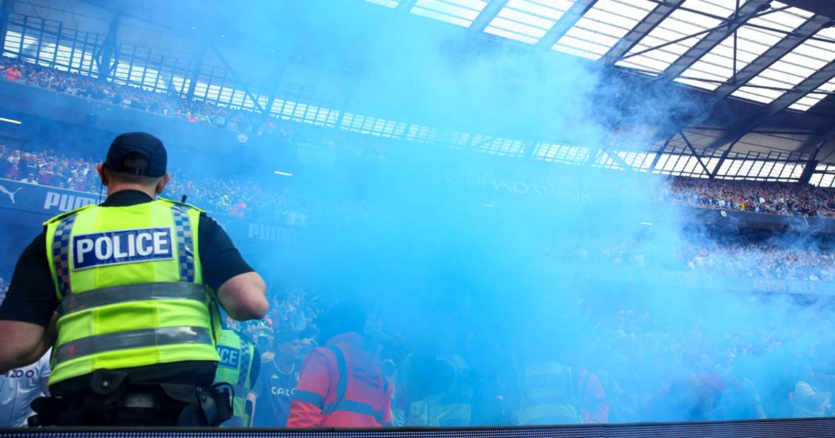Two supporters charged after Man City pitch invasion