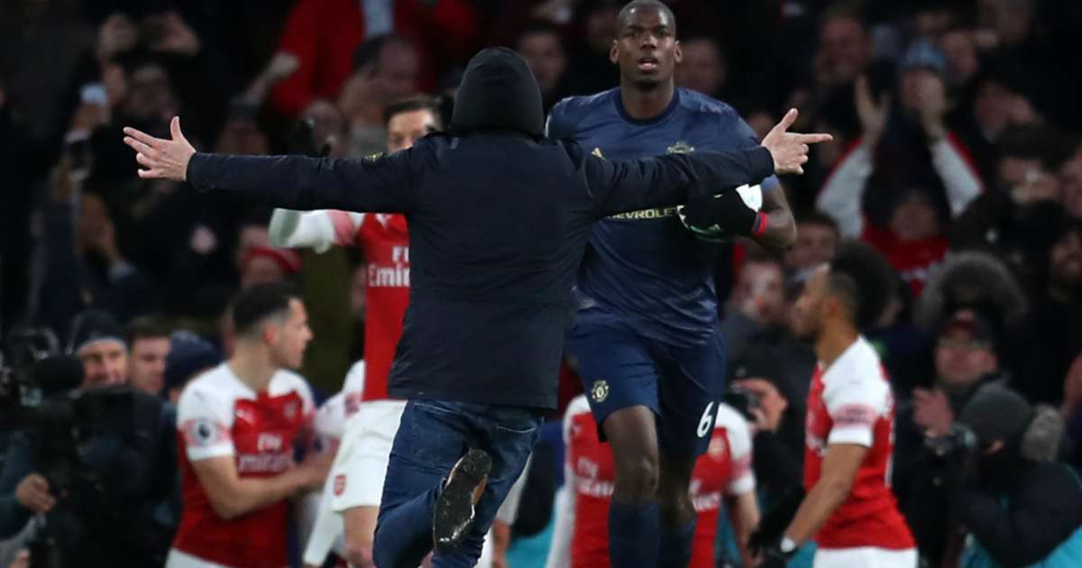 Pitch invader arrested after Smalling push